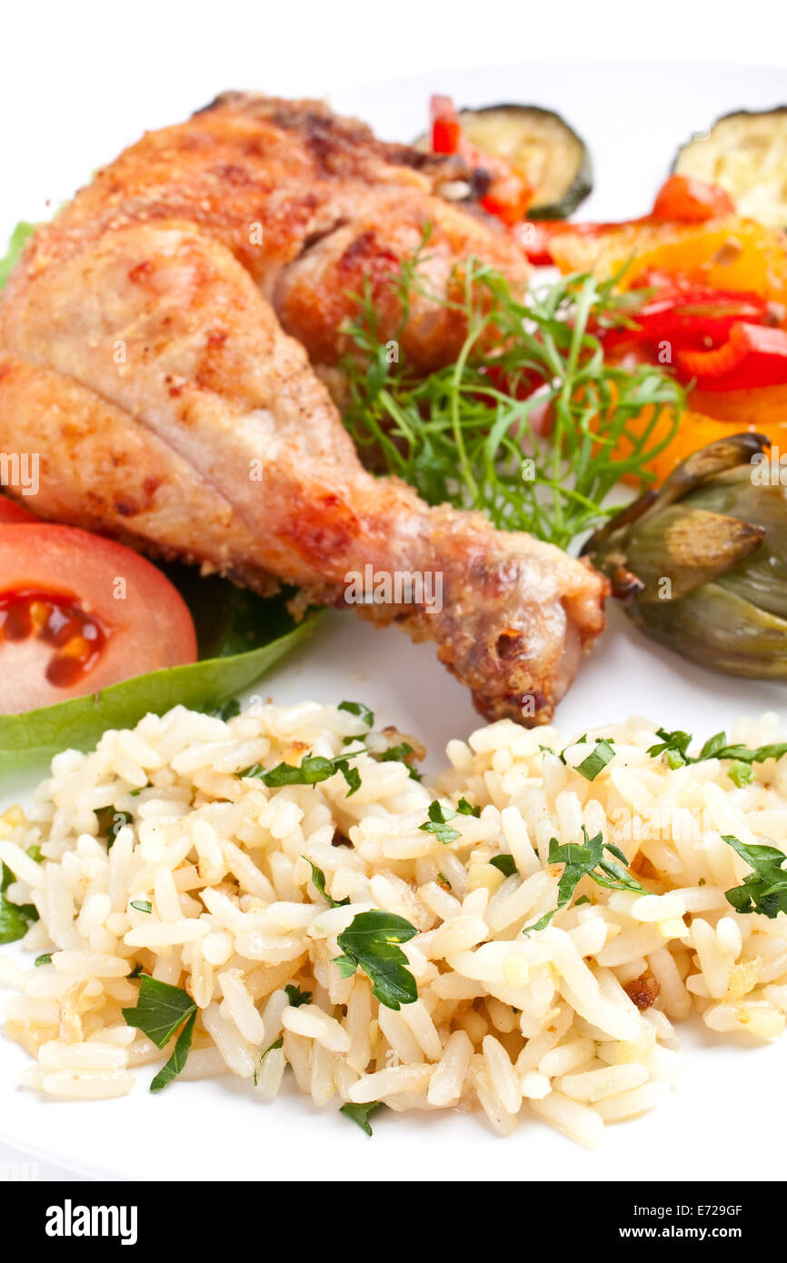 roasted chicken leg with rice and vegetables Stock Photo - Alamy