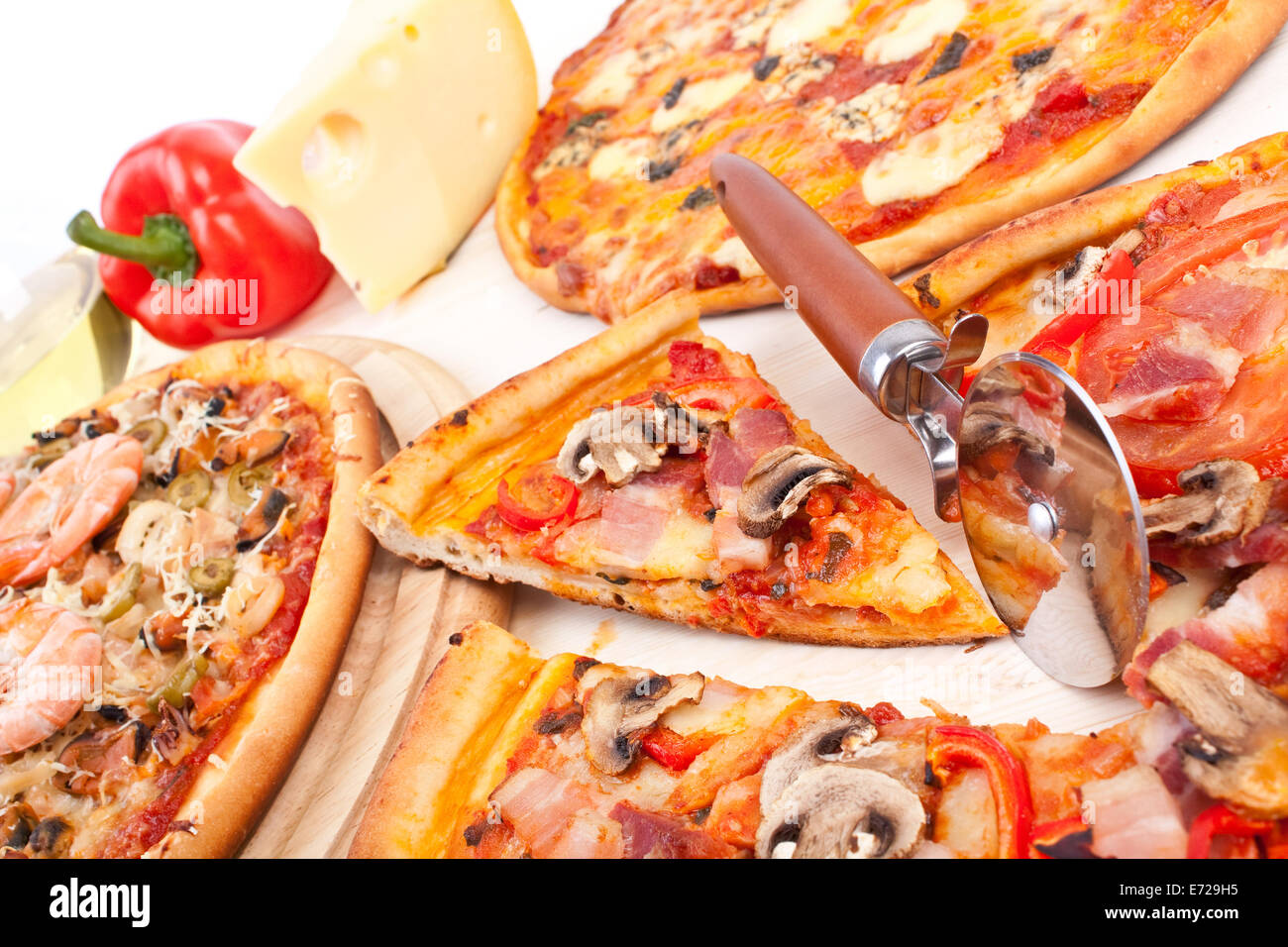 Three Different Pizzas with a Pizza-Knife Stock Photo - Alamy