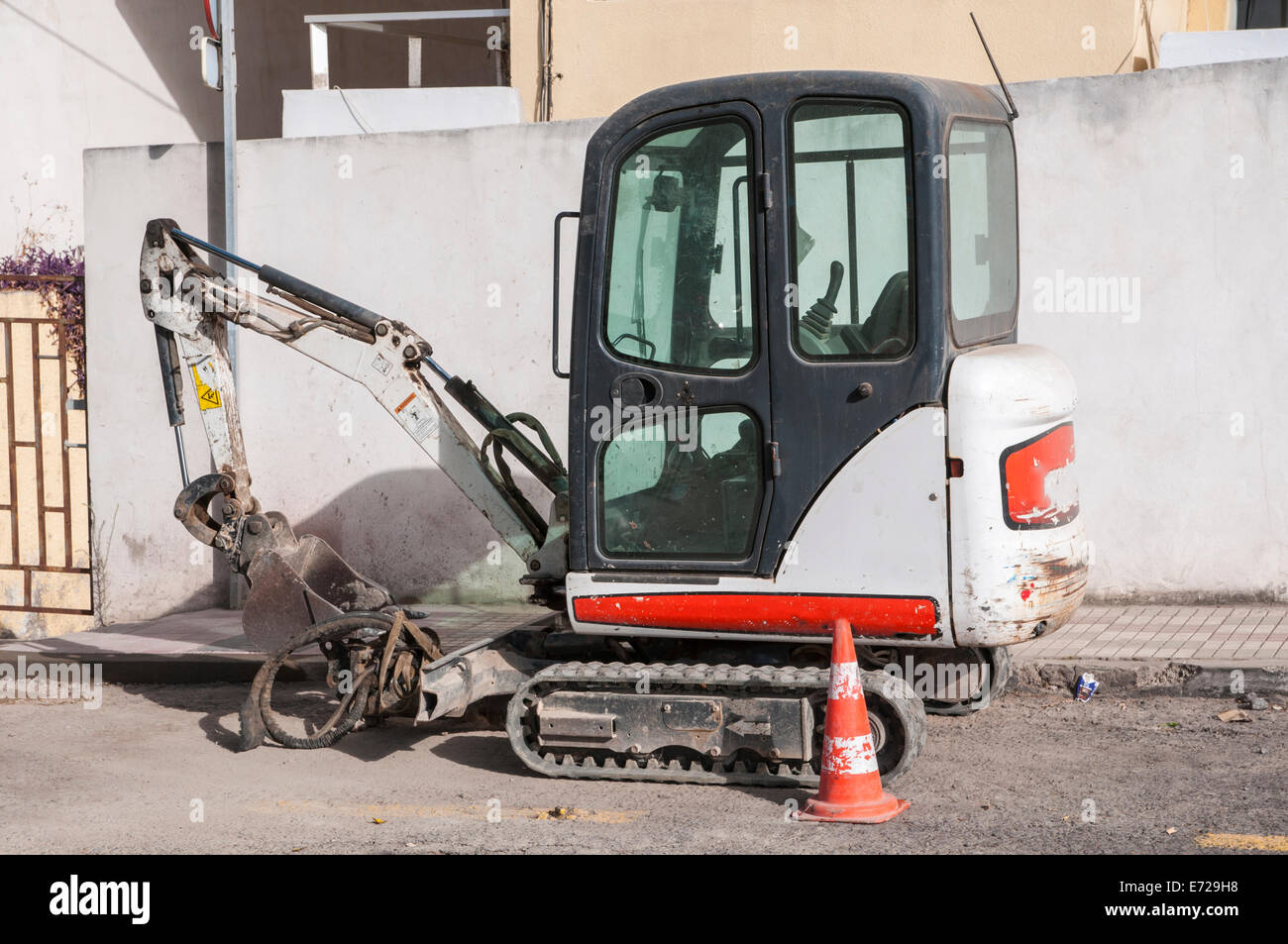 small bulldozer ready to dig the road Stock Photo - Alamy