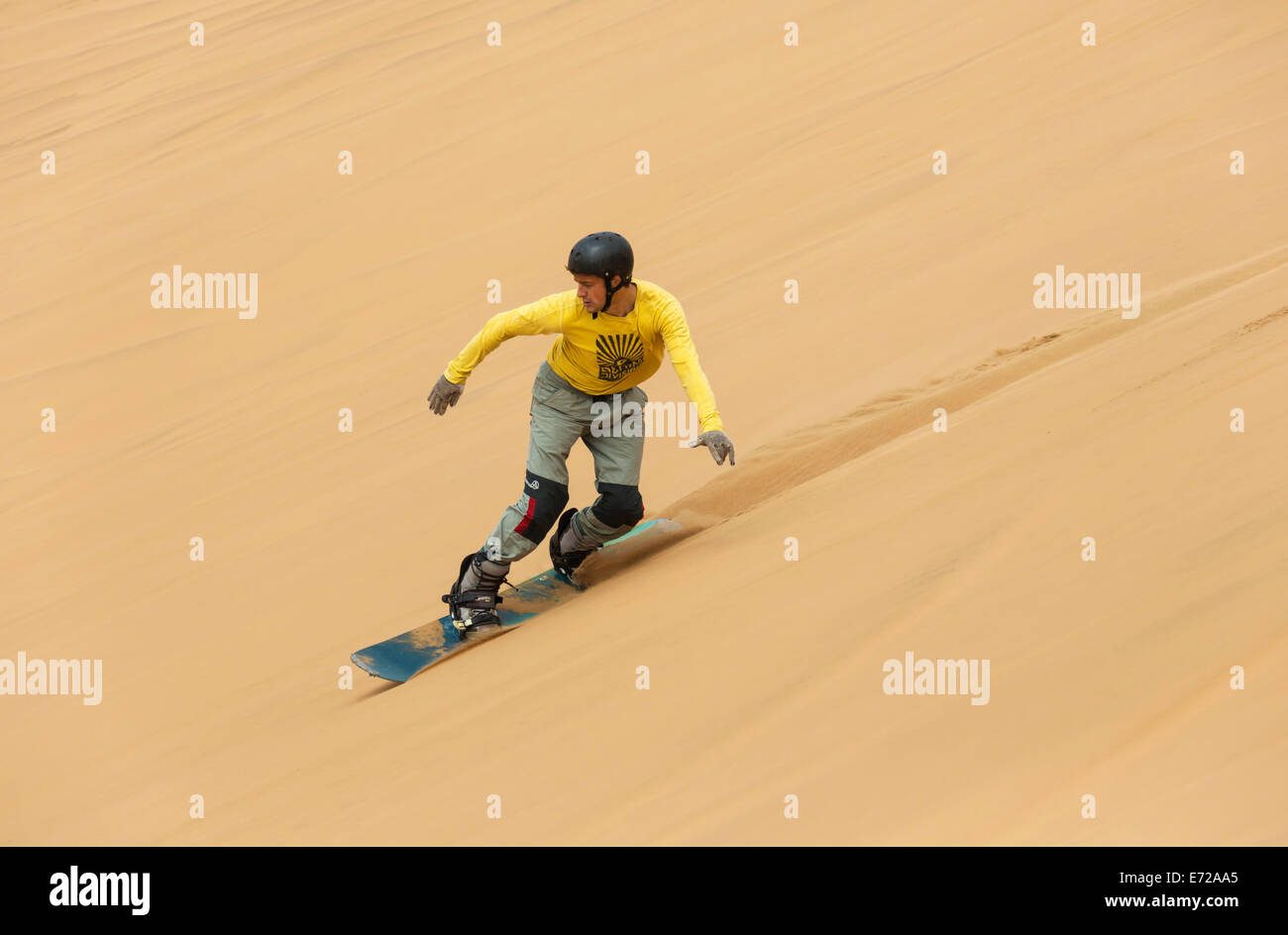 Sand boarding in the dunes of the Namib Desert, near Swakopmund, Namibia Stock Photo - Alamy