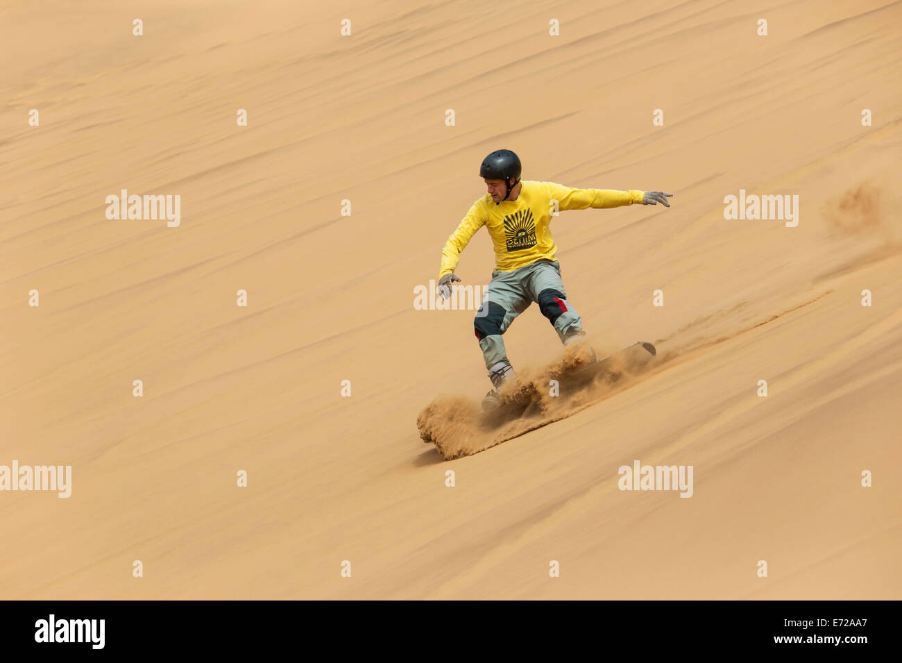 Sand boarding in the dunes of the Namib Desert, near Swakopmund, Namibia Stock Photo - Alamy