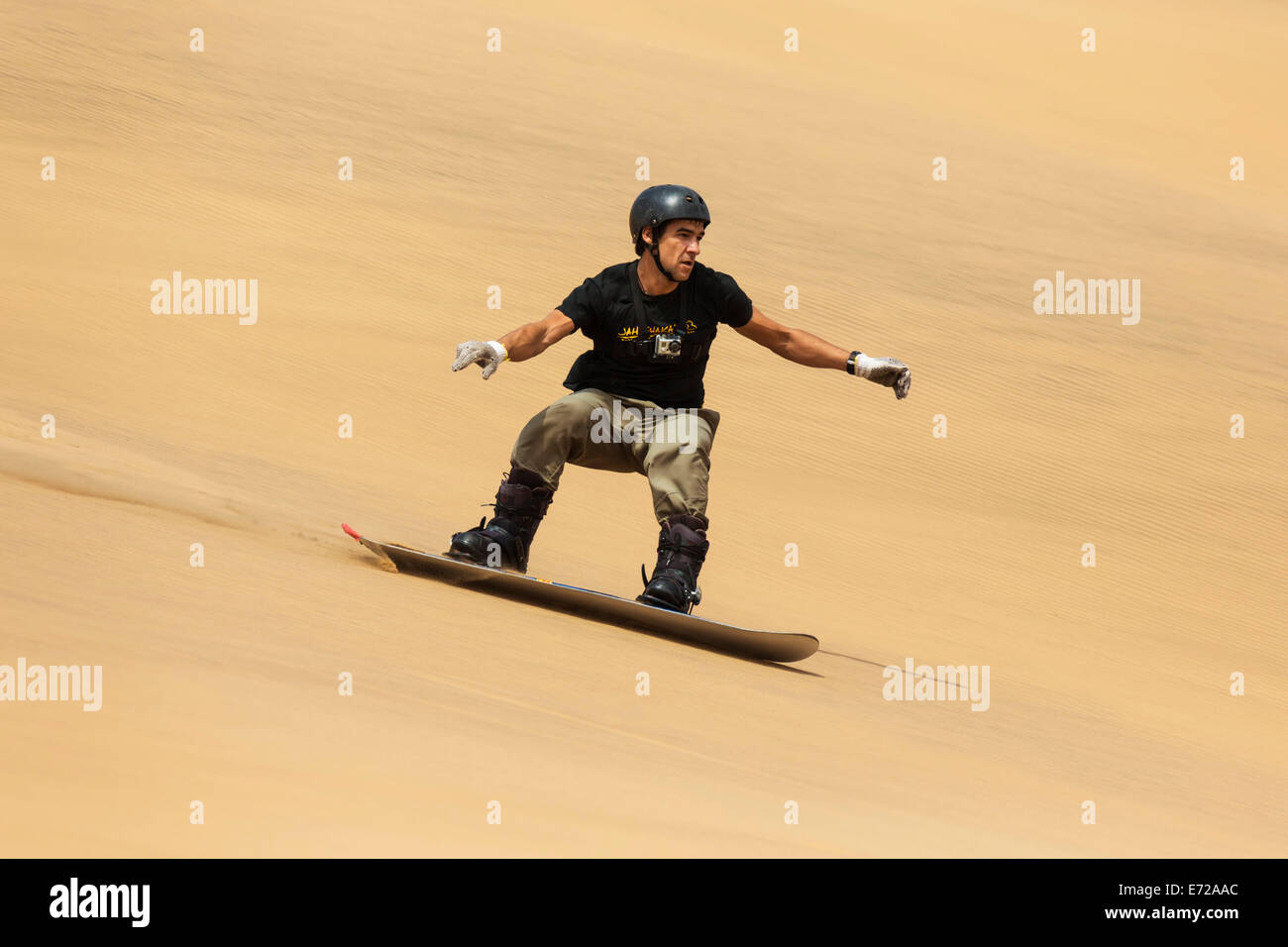 Sand boarding in the dunes of the Namib Desert, near Swakopmund, Namibia Stock Photo - Alamy
