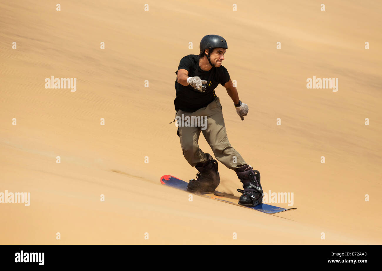 Sand boarding in the dunes of the Namib Desert, near Swakopmund, Namibia Stock Photo - Alamy