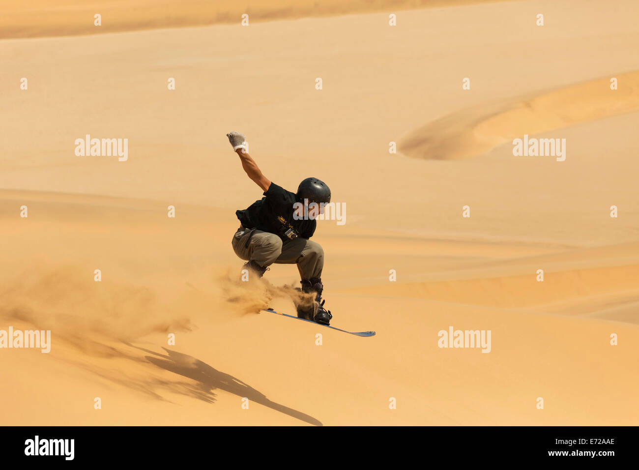 Sand boarding in the dunes of the Namib Desert, near Swakopmund, Namibia Stock Photo - Alamy