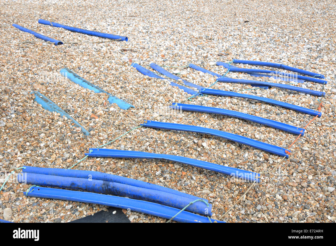 blue strips on sandy beach Stock Photo - Alamy