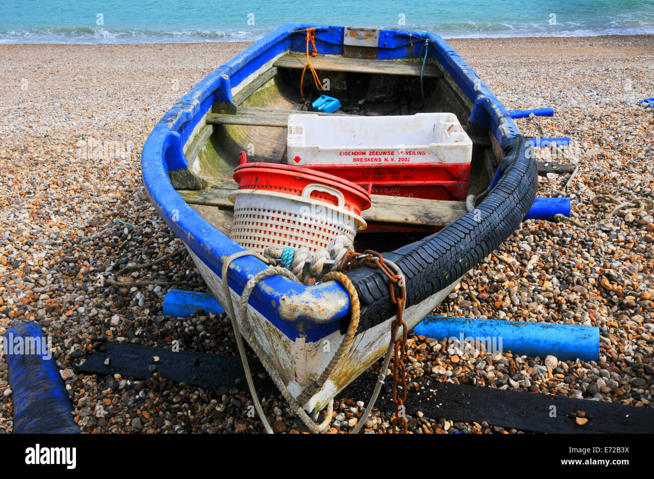 Fishing boats with rollers to pull boat from water Stock Photo - Alamy