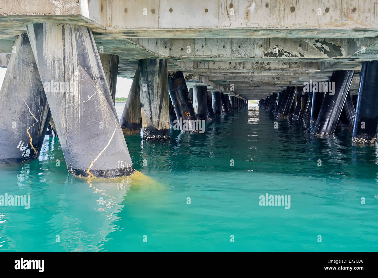 Criss-cross jetty pillars of power plant Stock Photo - Alamy