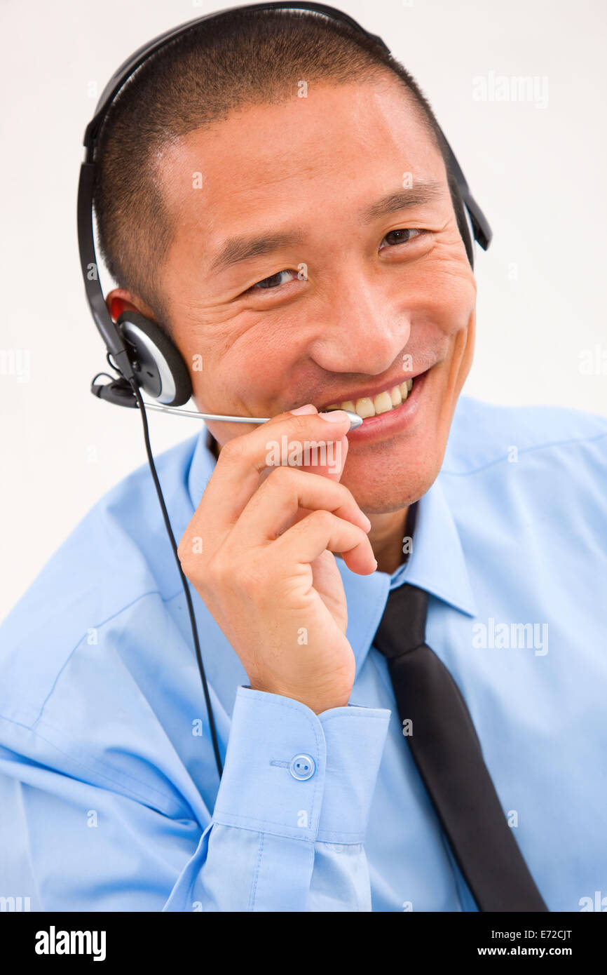 Close-up of smiling male customer service representative wearing ...