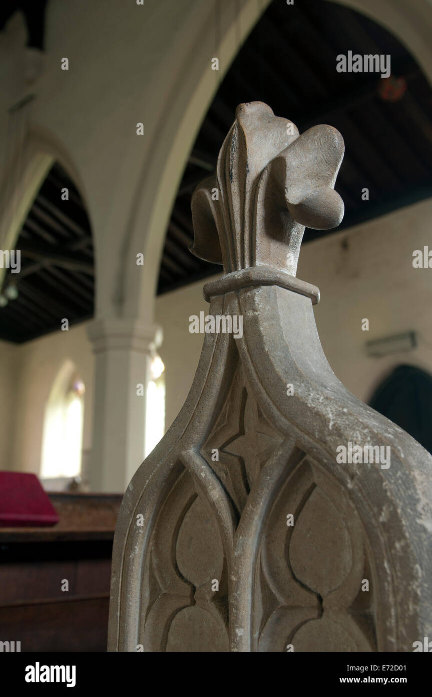 A stone pew end in St. Andrew`s Church, Kingham, Oxfordshire, England ...