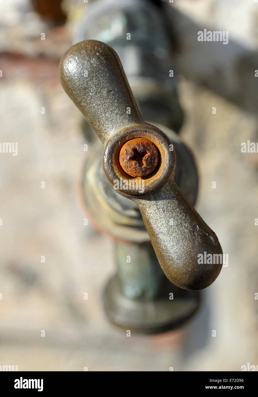 A rusty screw on an outside tap england uk Stock Photo - Alamy