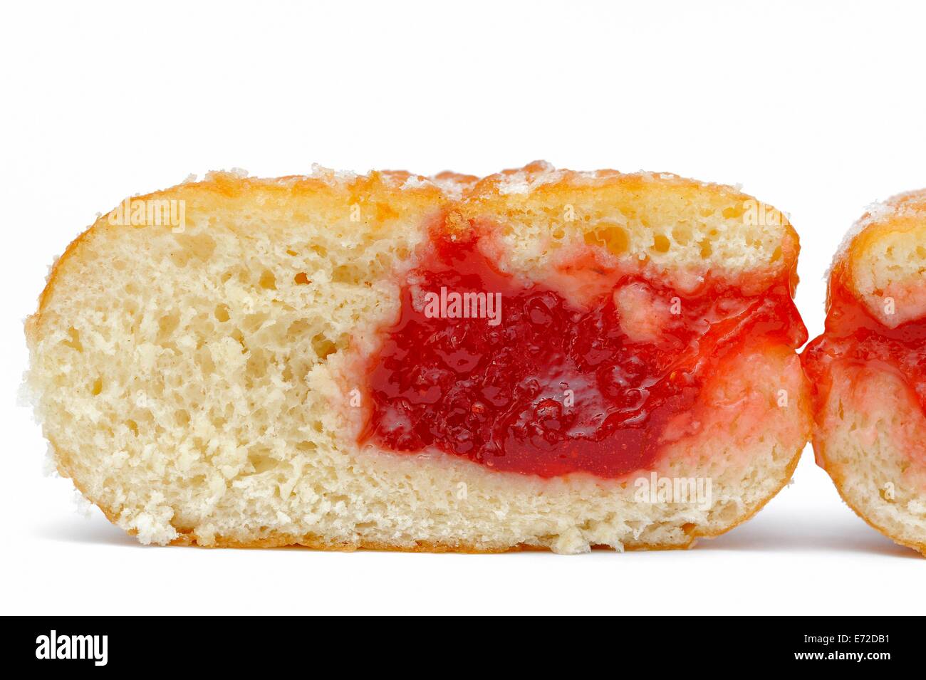 Jammy full of jam doughnut cut in half hi-res stock photography and ...