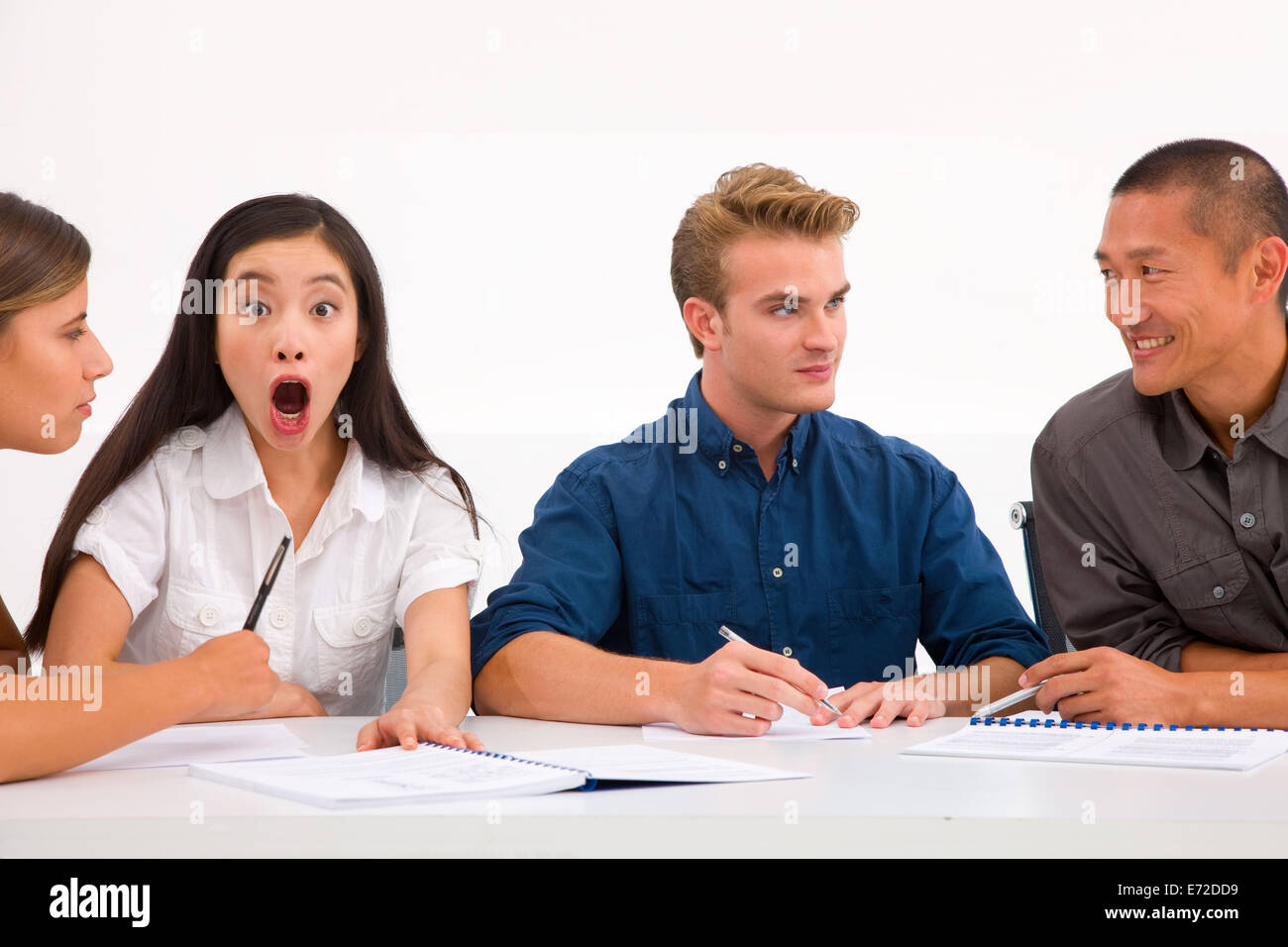 Surprised businesswoman with her colleagues workplace Stock Photo - Alamy