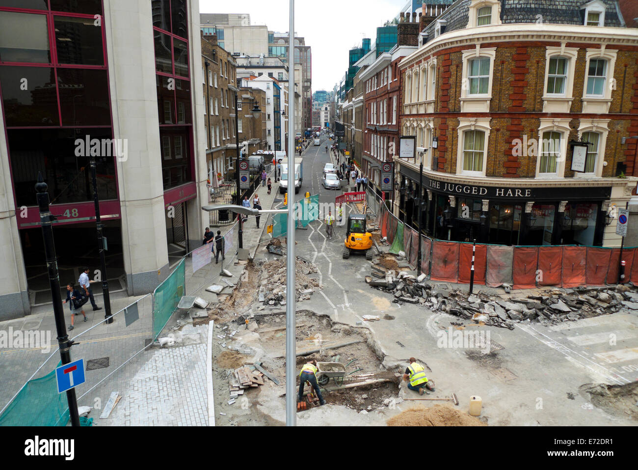 View of men digging up roads in ROADWORKS enhancement project on ...