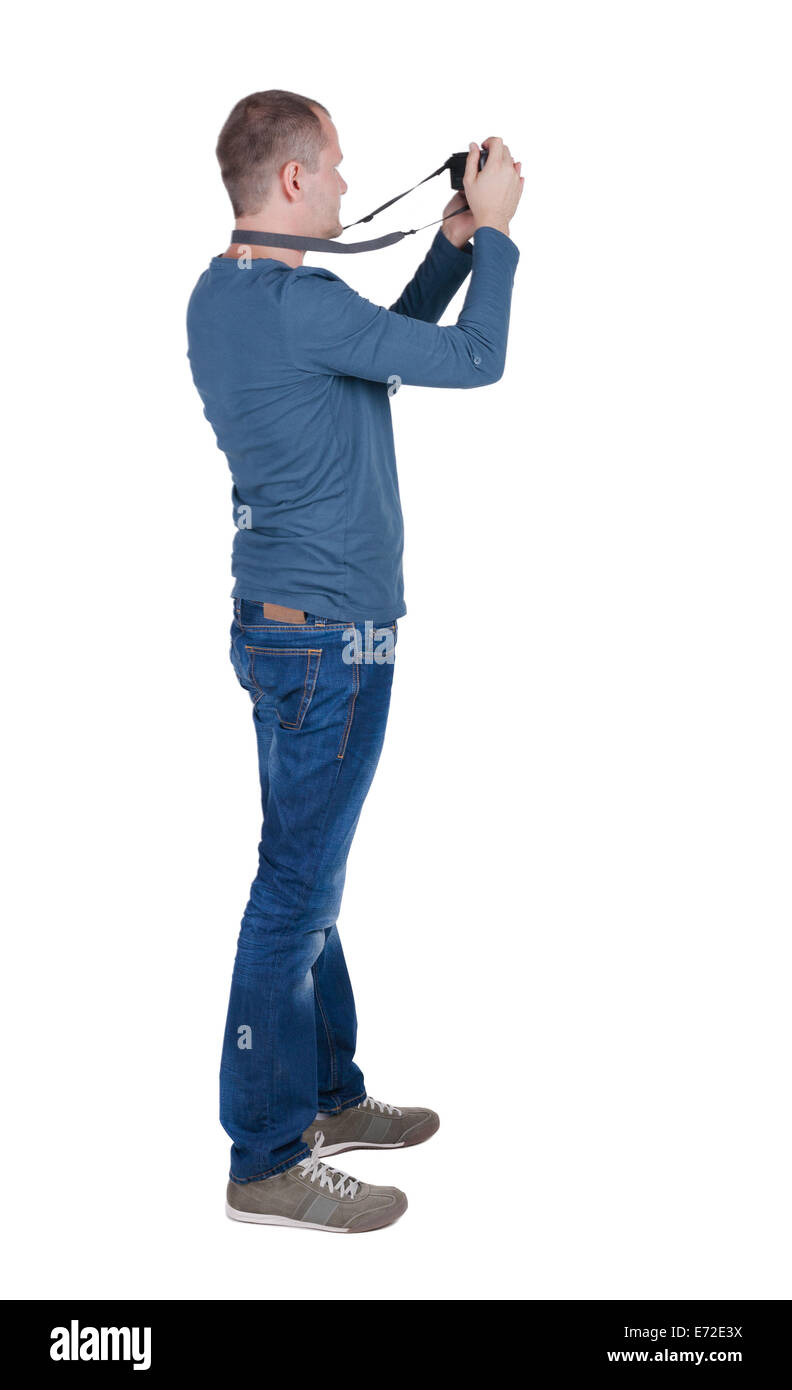 Back view of man photographing. photographer in jeans. Rear view people ...