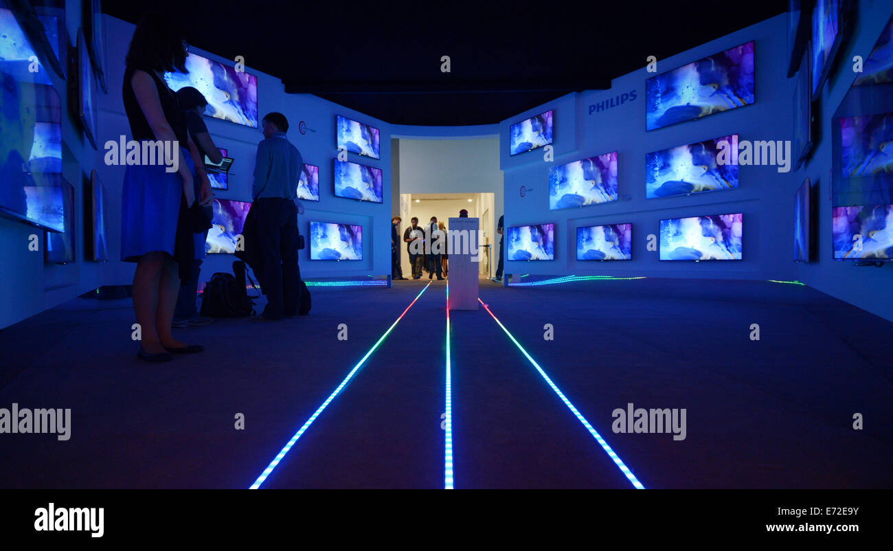 Berlin, Germany. 04th Sep, 2014. People look at a TV installation at ...