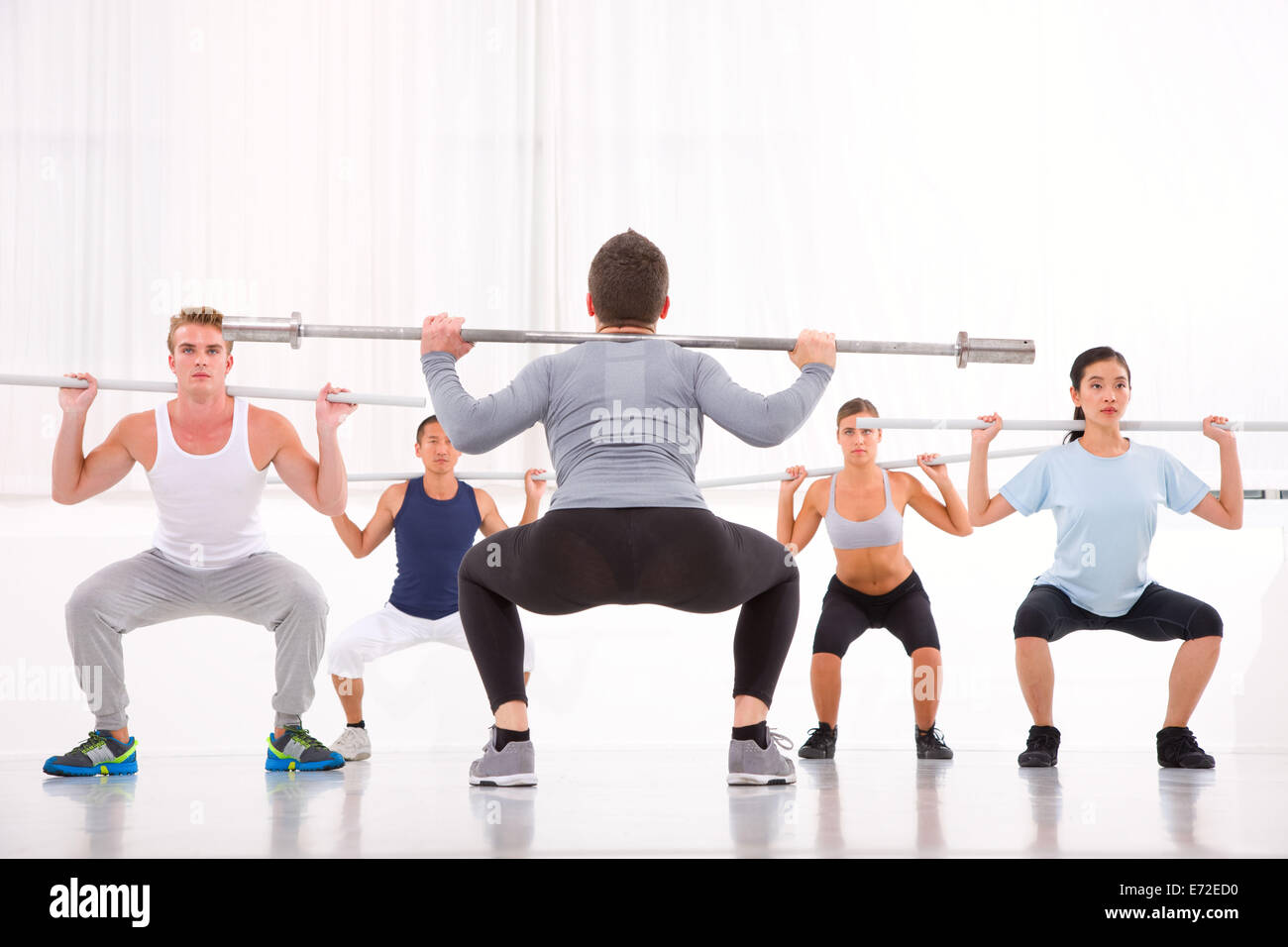 Diverse group of people exercising in gym Stock Photo - Alamy