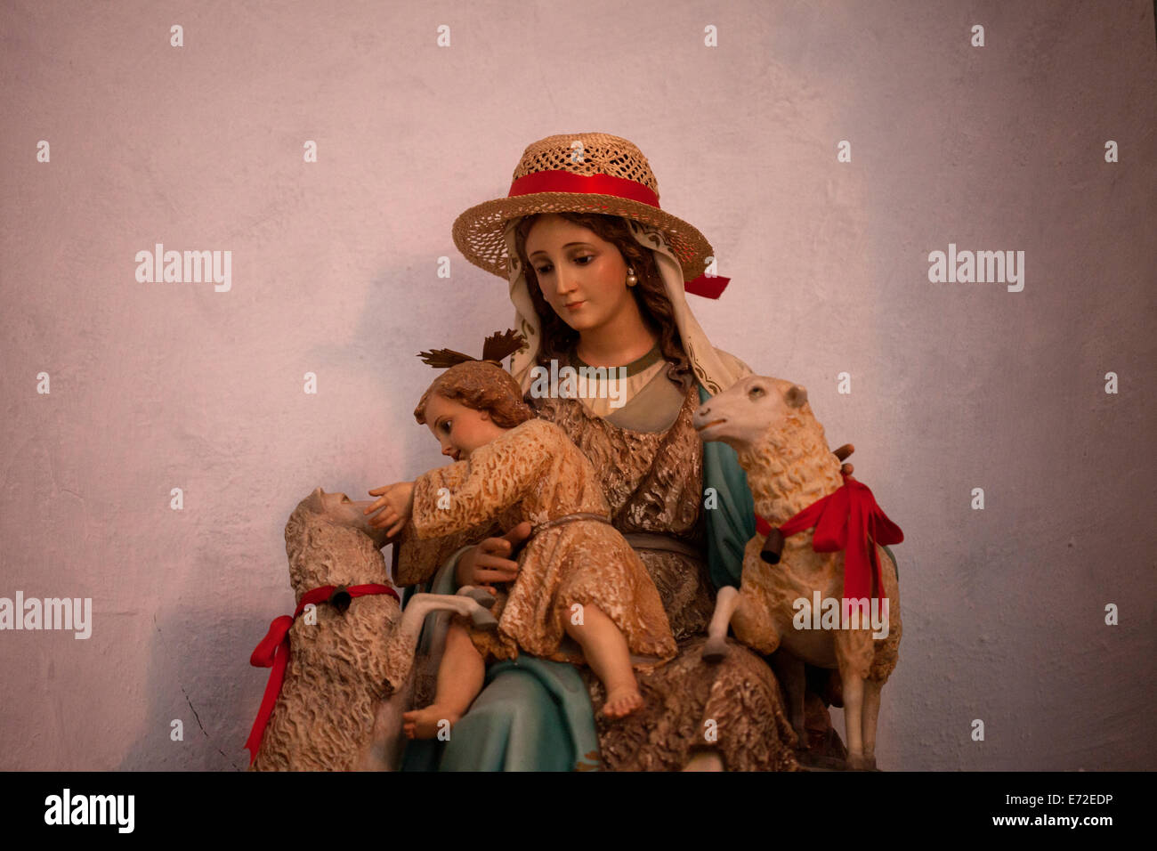 An sculpture of the Virgin Mary seen as the Divine Shepherdess, holding ...