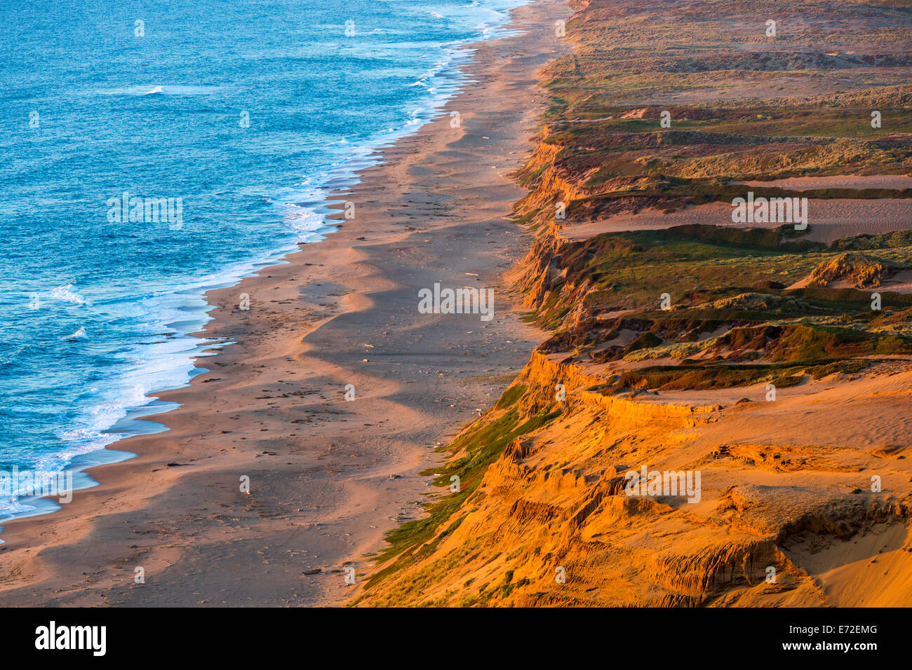 Days last light strikes the sandy shore of Point Reyes Beach at Point ...