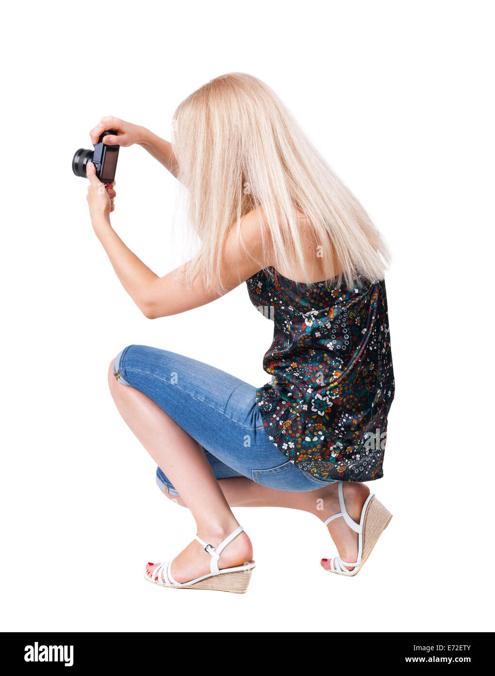 Back view of woman photographing. girl photographer in jeans. Rear view ...