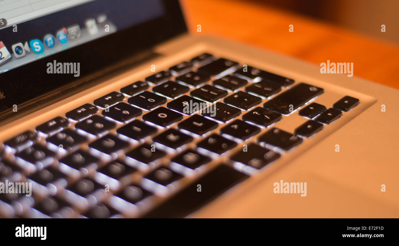 The distinctive illuminated keyboard of an Apple Macbook laptop ...