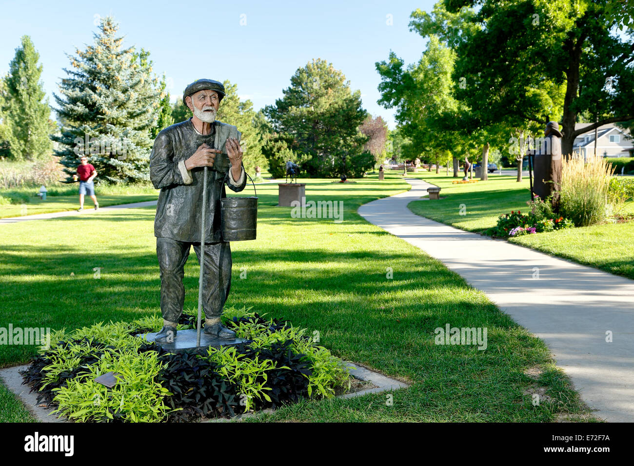 "The Potato Man" sculpture, by Susan Geissler, and walker on trail ...