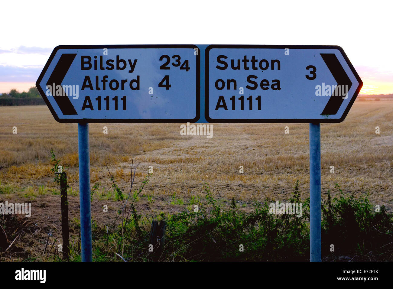 Lincolnshire rural road sign on the A1111 at sunset Stock Photo - Alamy