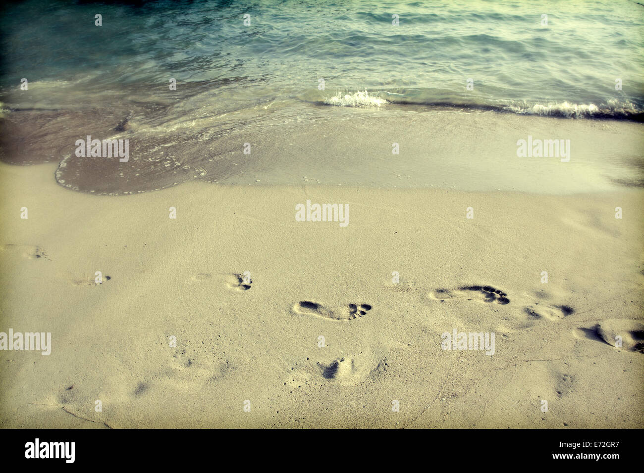 Footsteps in the sand at the beach Stock Photo - Alamy