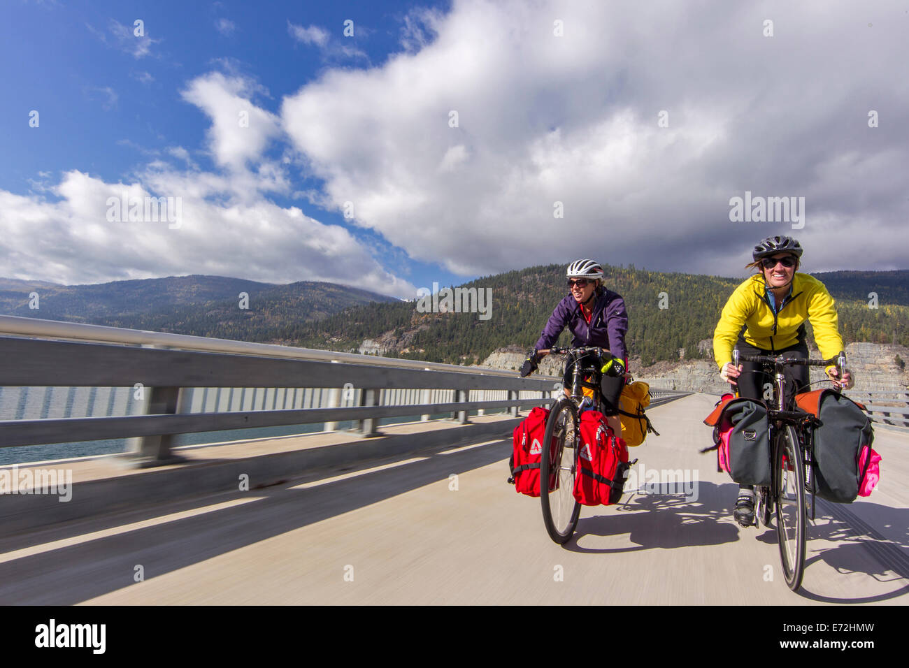 Bike touring across the Lake Koocanusa bridge in the Kootenai National ...