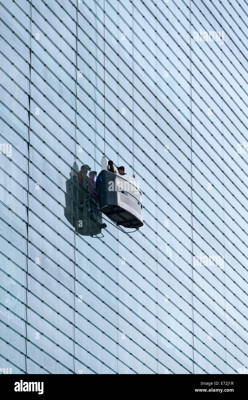 Window cleaners in a suspended cradle on the No.1 Deansgate building ...