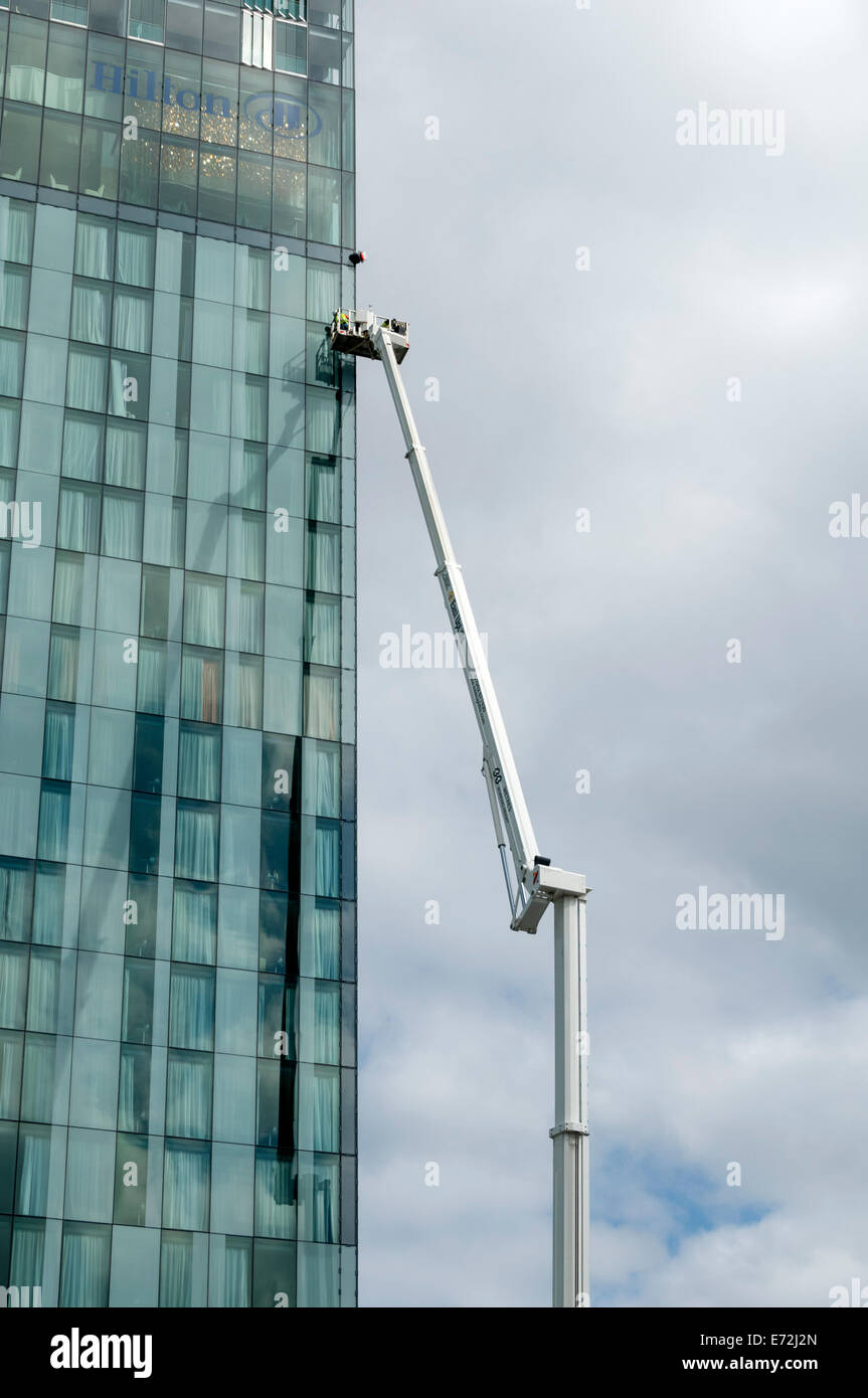 Maintenance workers in an access platform cradle at the Beetham Tower ...