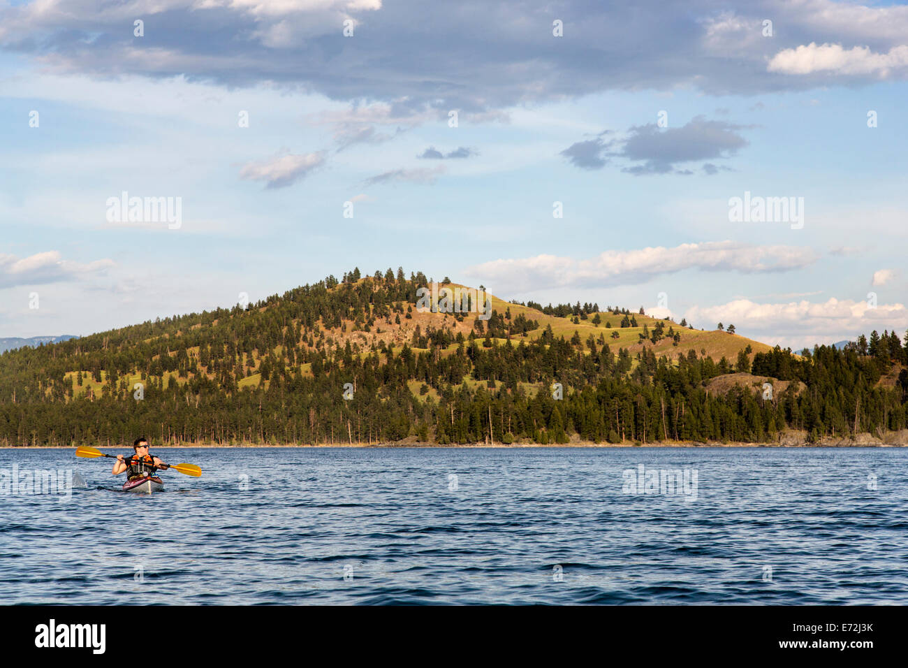 Logan Haney sea kayaking on Flathead Lake with Wild Horse Island State ...