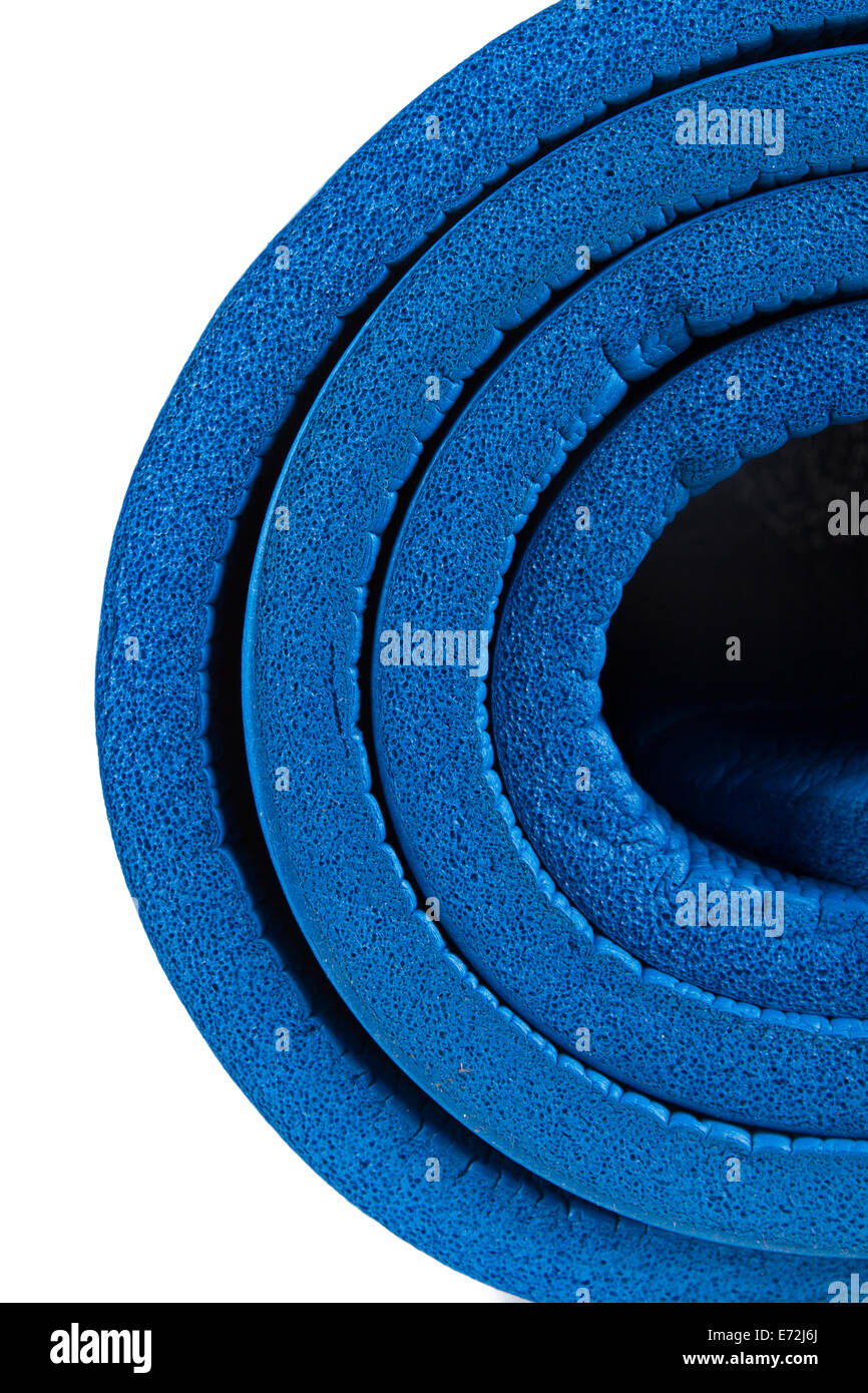 Detail view of blue yoga mat, isolated on white background Stock Photo ...