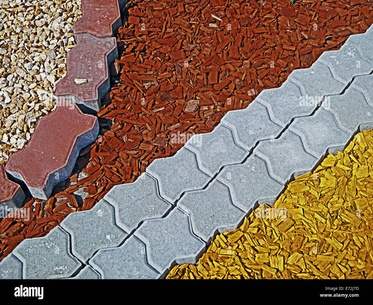 Paving garden ornaments with stone and wood chips colored Stock Photo ...