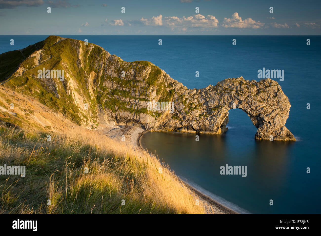 Sunset over Durdle Door along the Jurassic Coast, Dorset, England Stock ...