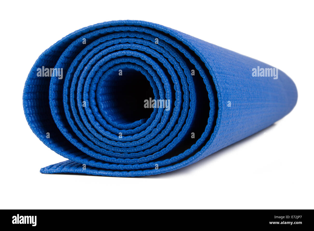 Side view of blue rolled fitness mat, isolated on white background ...