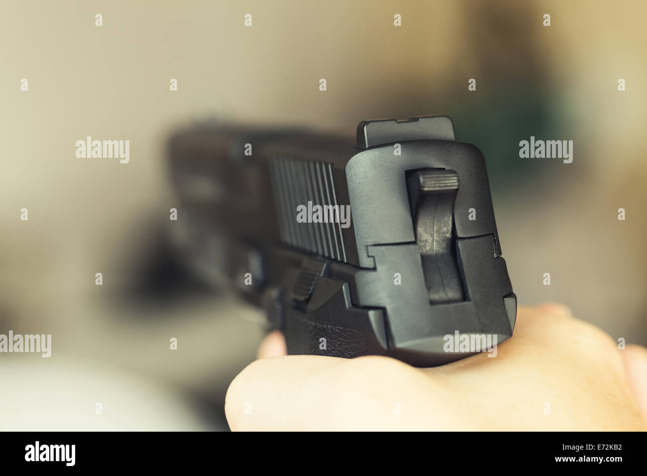 Man with a gun ready to shoot - focus on the back part of gun Stock ...