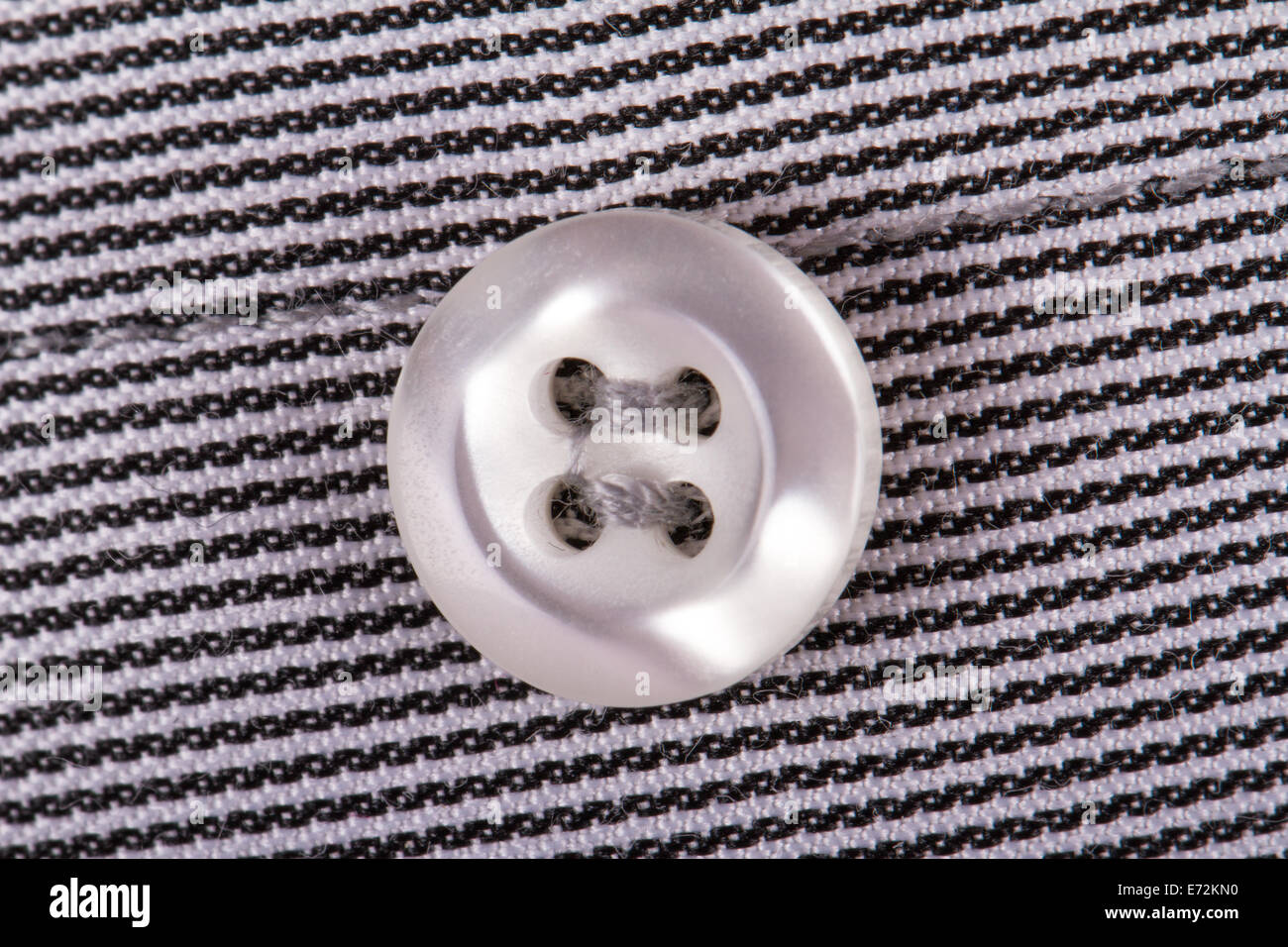 Close up view of shirt button Stock Photo - Alamy