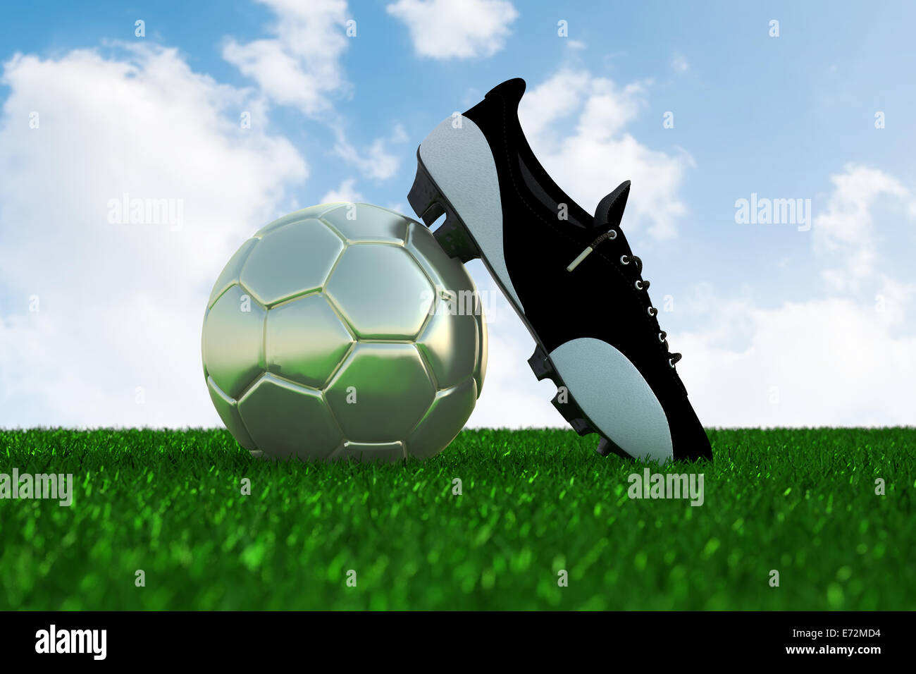 Soccer ball on green field with soccer shoe Stock Photo - Alamy