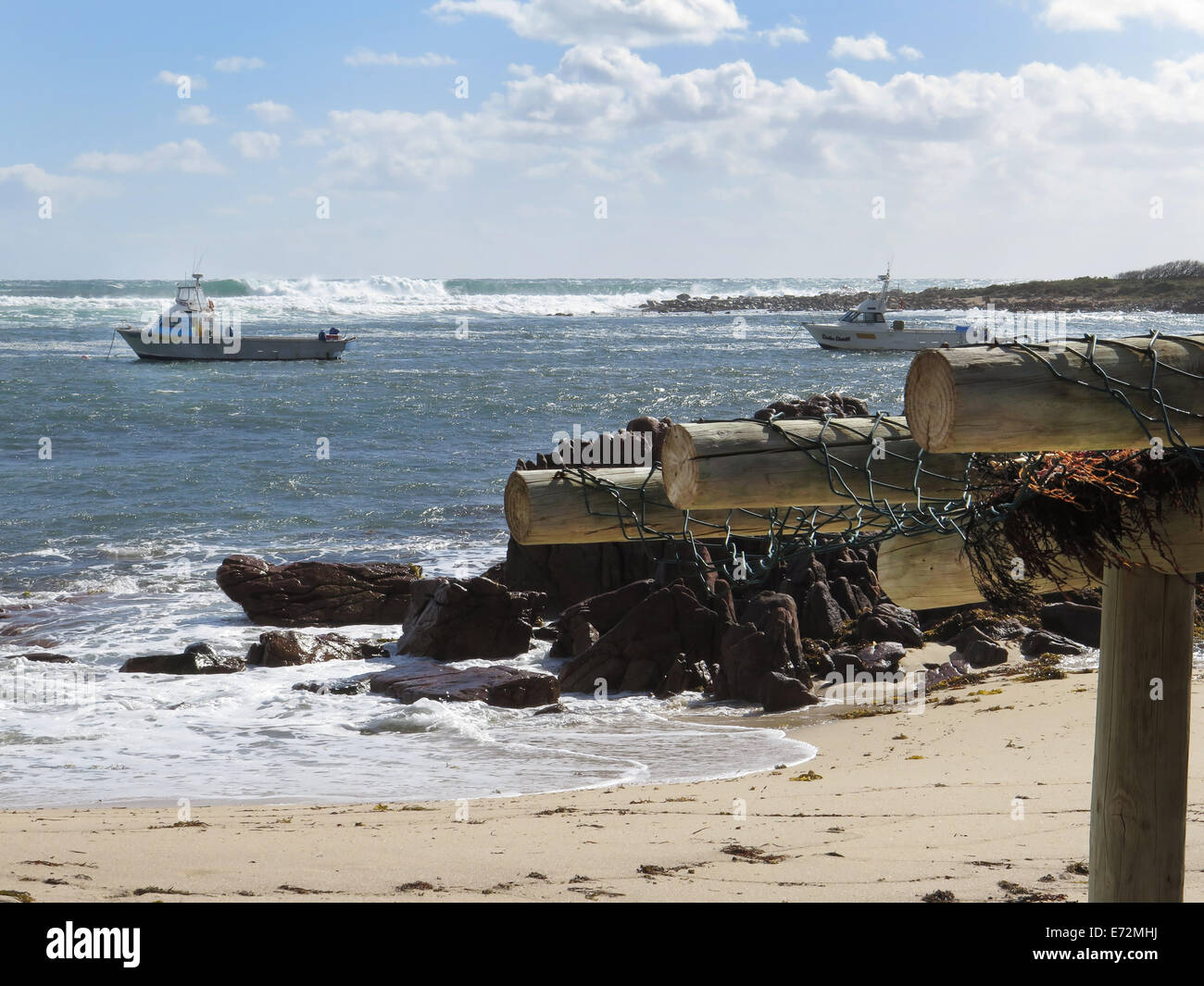 Rough seas at Gracetown, Western Australia with two fishing boats ...
