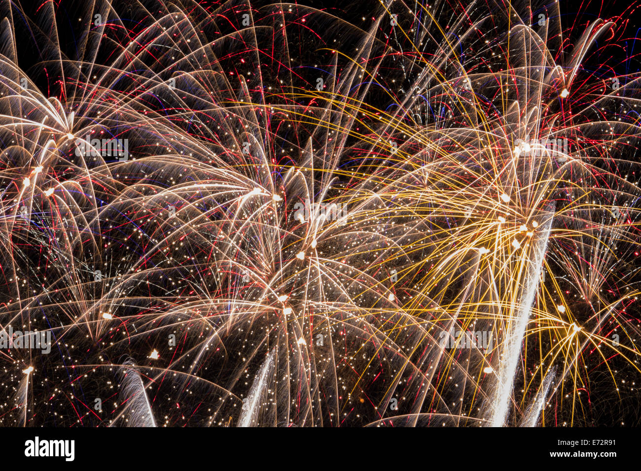 Fireworks - fiesta of red, blue, white, and gold Stock Photo - Alamy