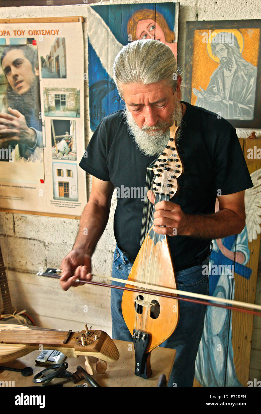 Mr. Manolis Haroulis, artist and handicraftsman in his workshop at Exo ...