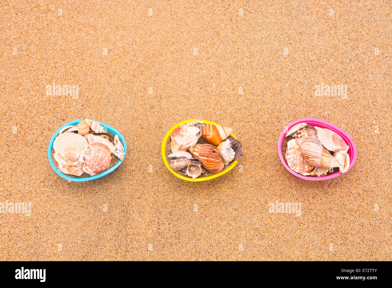 Decorative Easter egg baskets on the beach filled with seashells for ...
