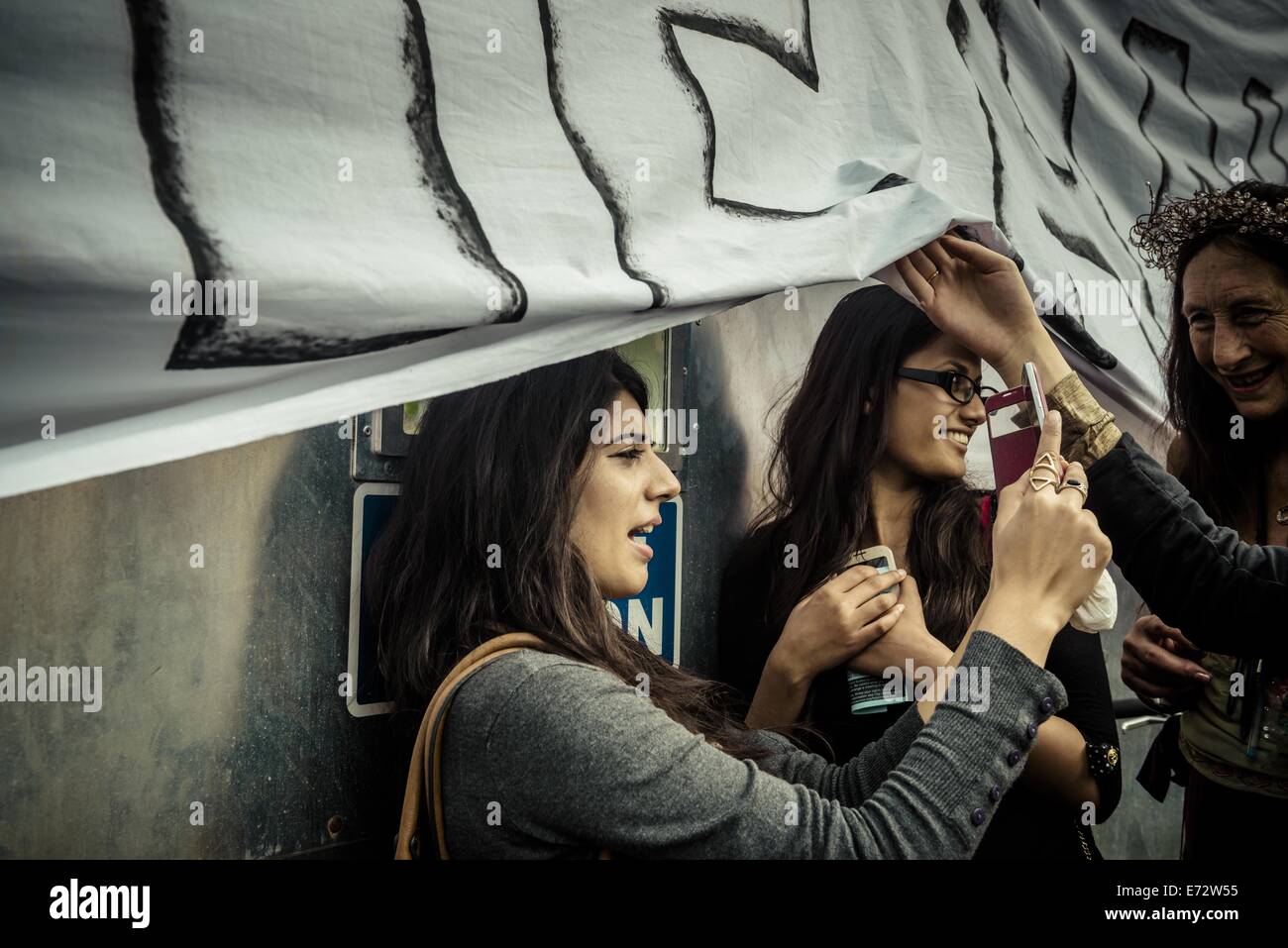 Cardiff, Wales, UK. 4th Sept, 2014. A girl takes a 'selfie' with riot ...