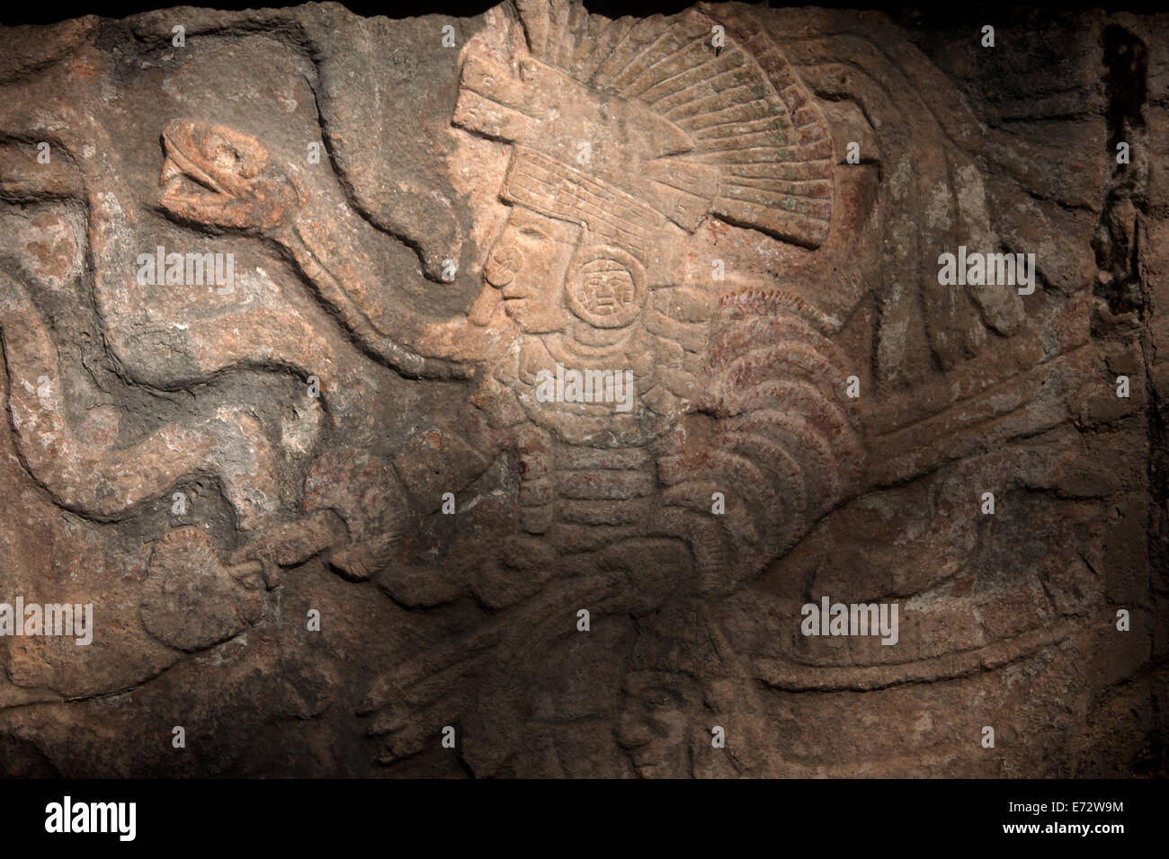 A Toltec warrior with a snake in the right arm holding a human head ...