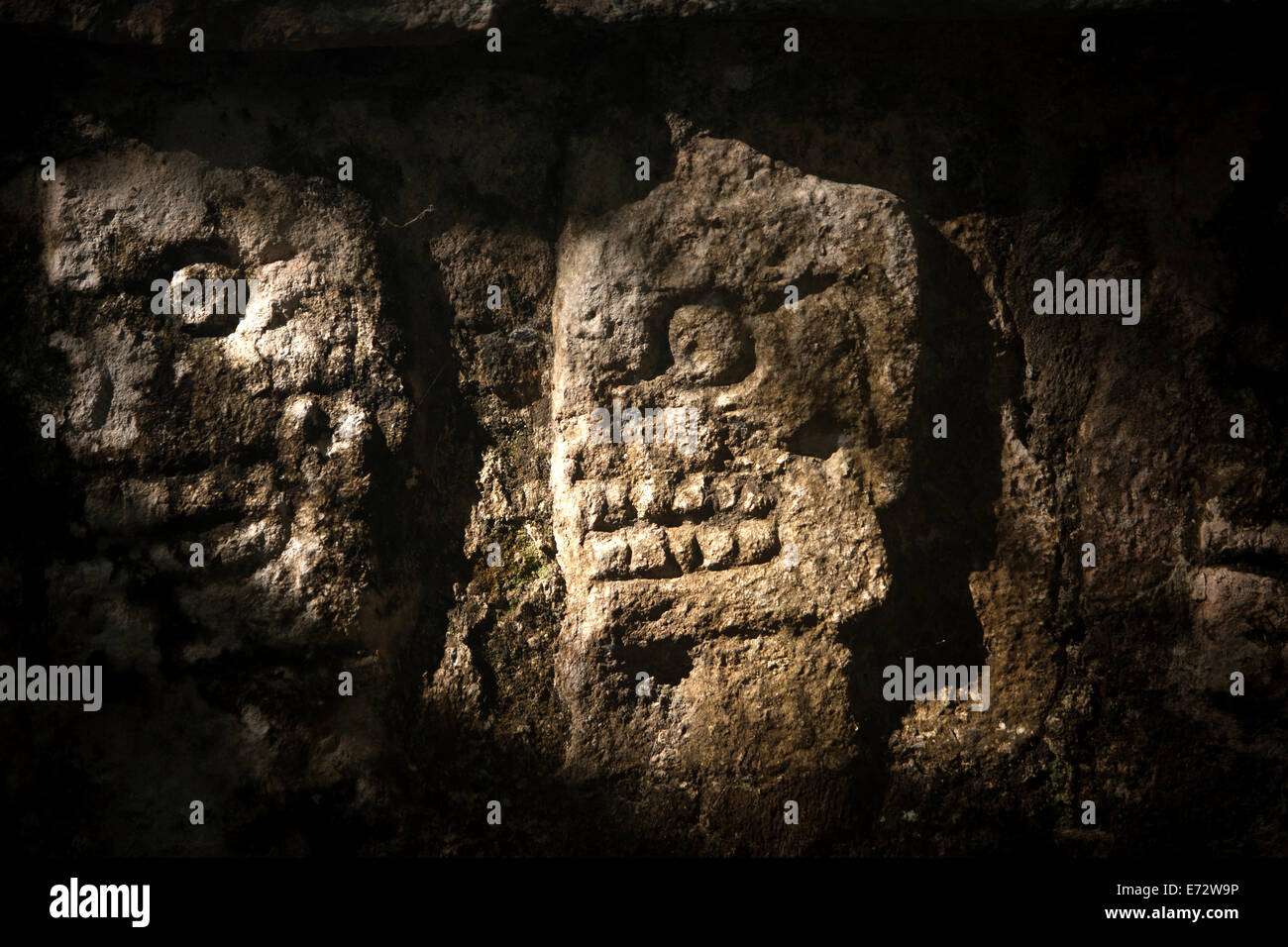 Skulls decorate the tzompantli or Skull Platform in the Mayan city of ...