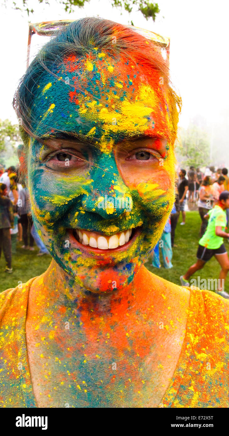 Portrait of woman covered with colorful paint Stock Photo - Alamy