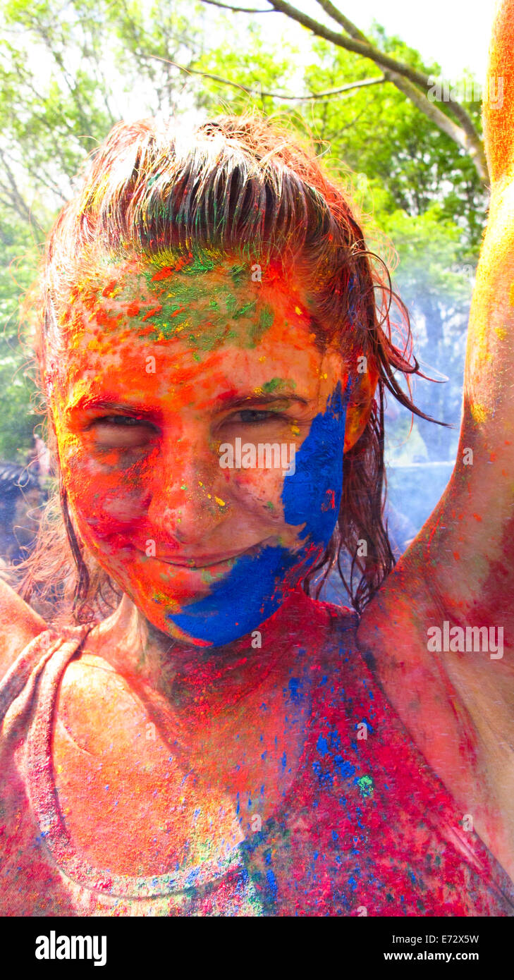 Portrait of woman covered with colorful paint Stock Photo - Alamy