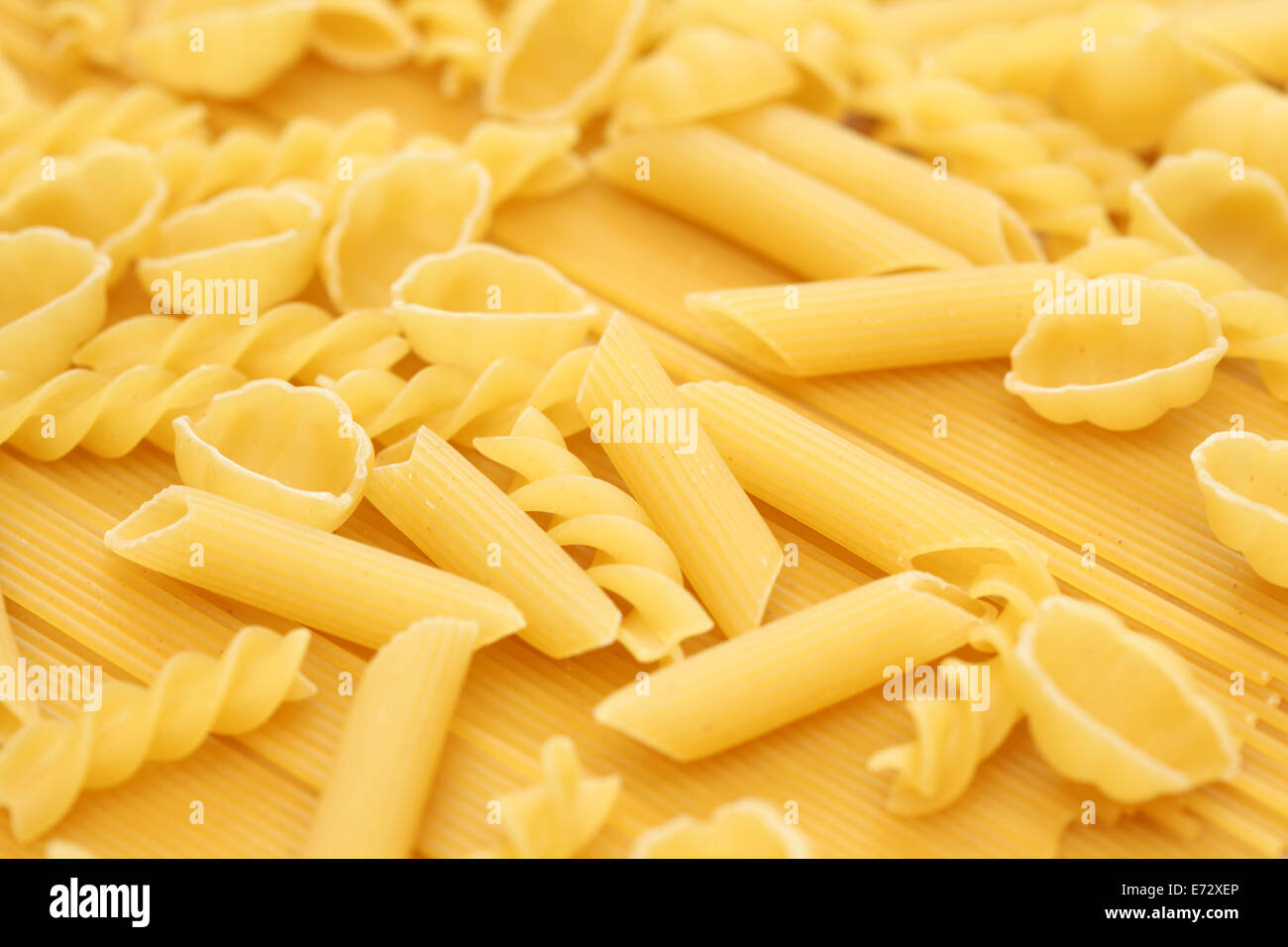 Raw pasta background. Closeup Stock Photo - Alamy