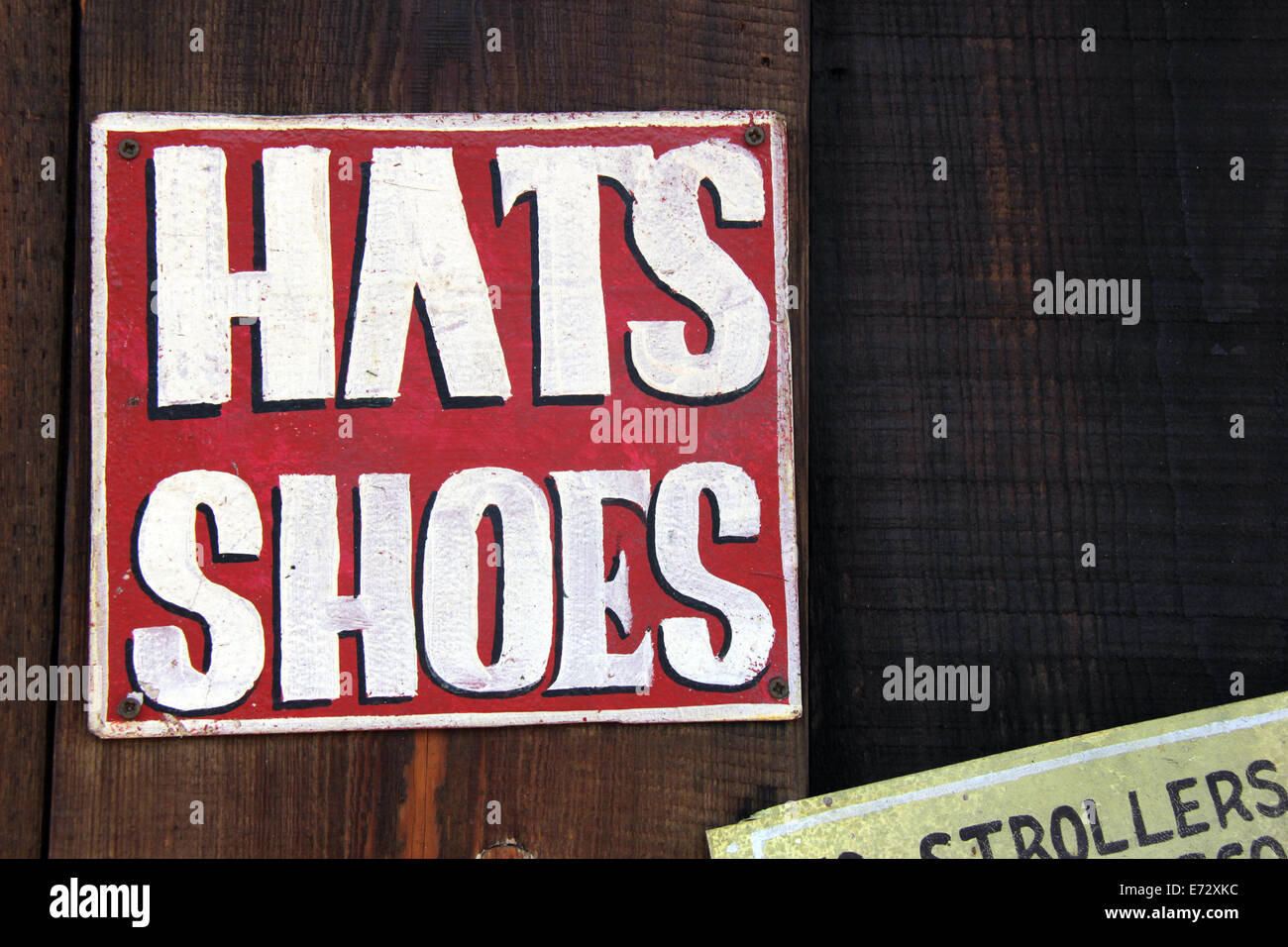 Hats and shoes sign painted on a wall Stock Photo - Alamy