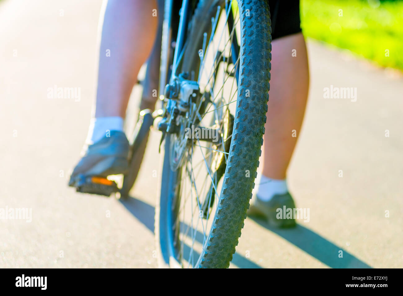 bicycle wheel and foot girl close-up Stock Photo - Alamy